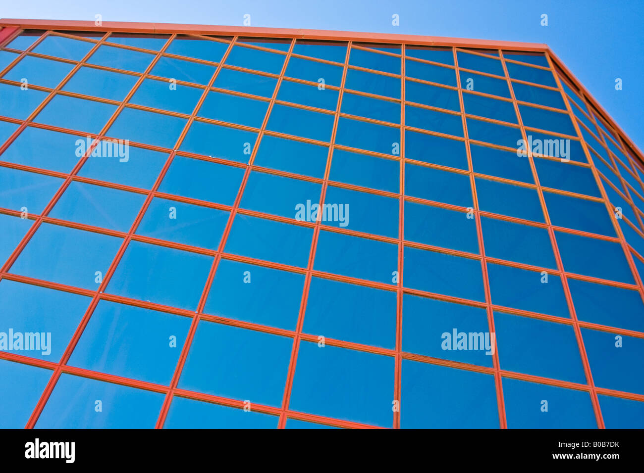 Blue windows from office building against blue sky Stock Photo - Alamy