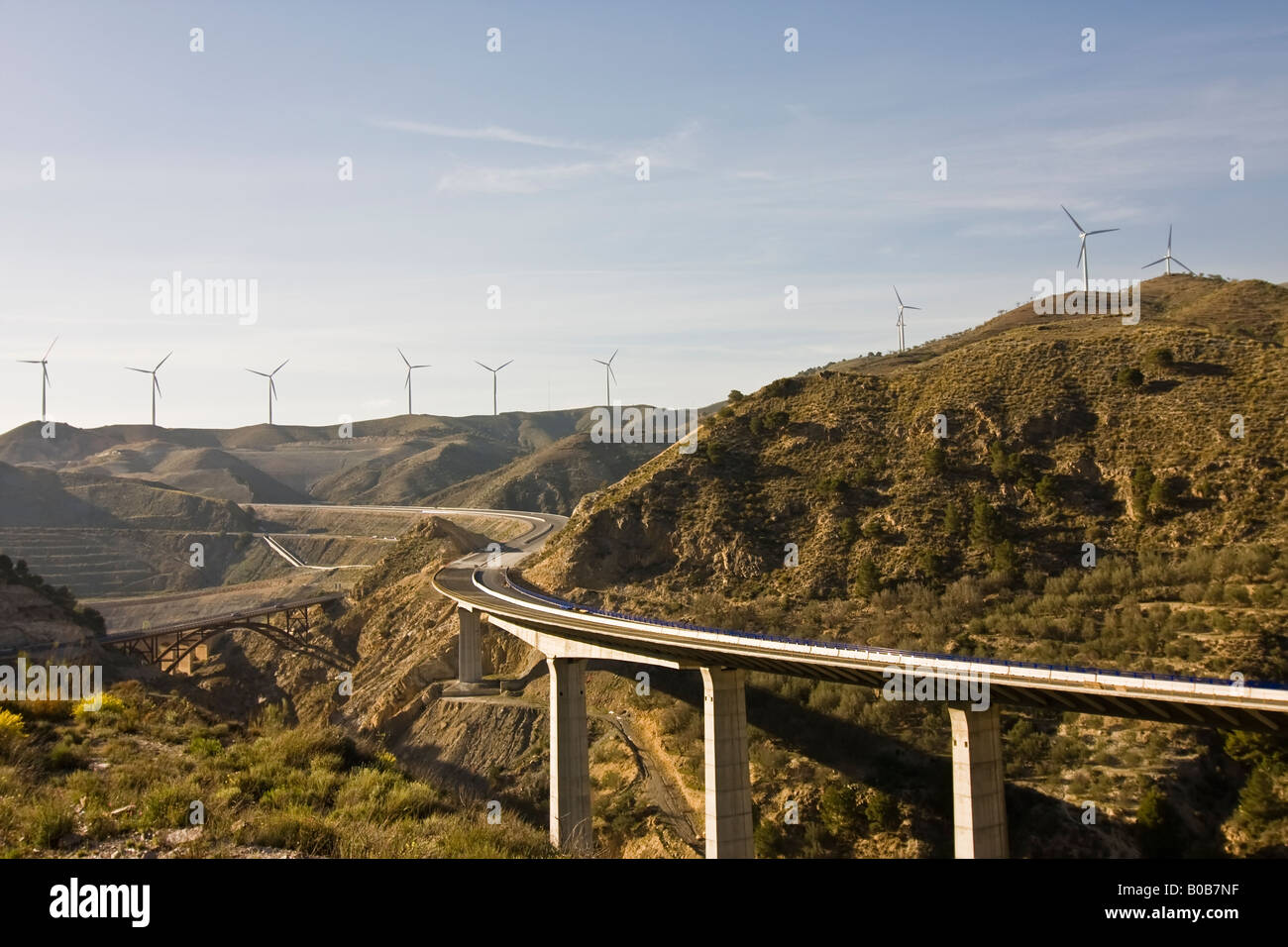 Brand new highway under windmill scenic Stock Photo - Alamy