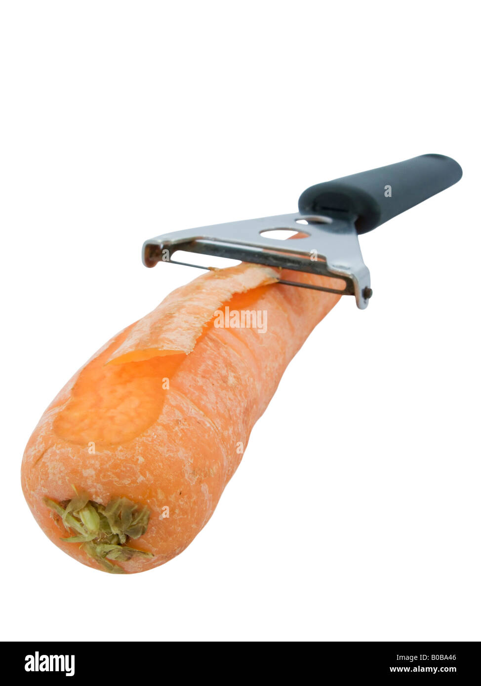 One ripe carrot with peeler Stock Photo - Alamy