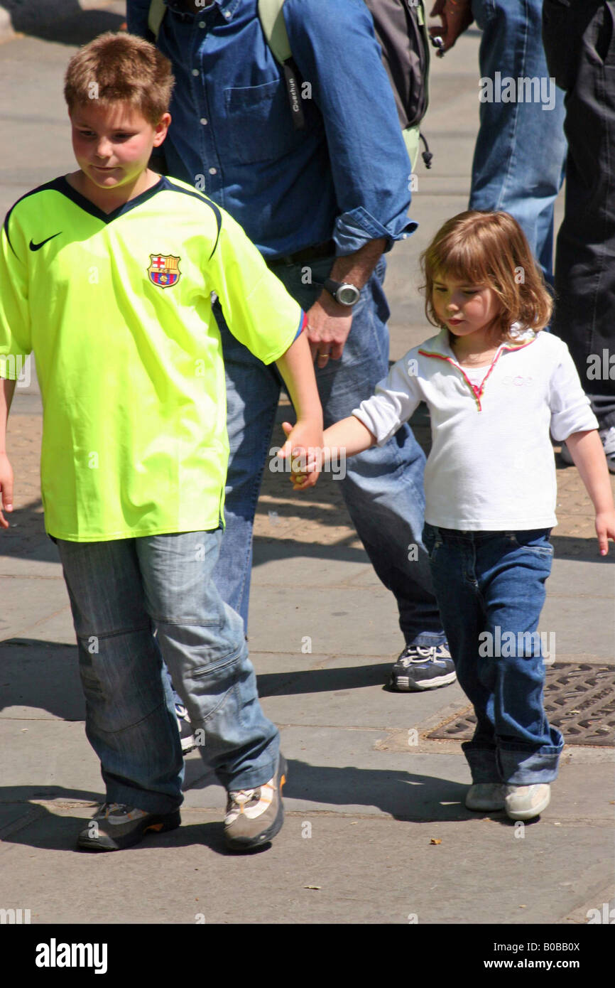 Kids crossing road Stock Photo - Alamy