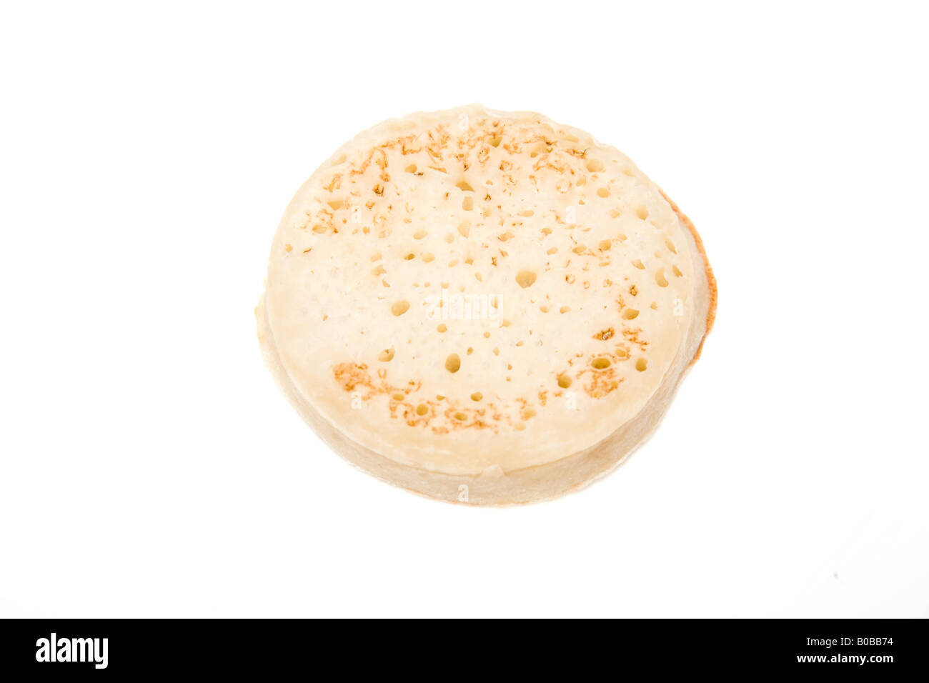 Crumpet isolated on a white studio background Stock Photo - Alamy