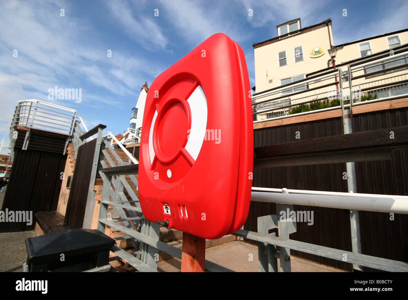 Modern housing for life saving ring on sea wall handrail in Bridlington ...