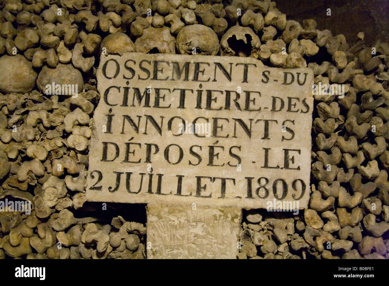 Human skulls and bones stacked in rows in the underground Catacombs ...