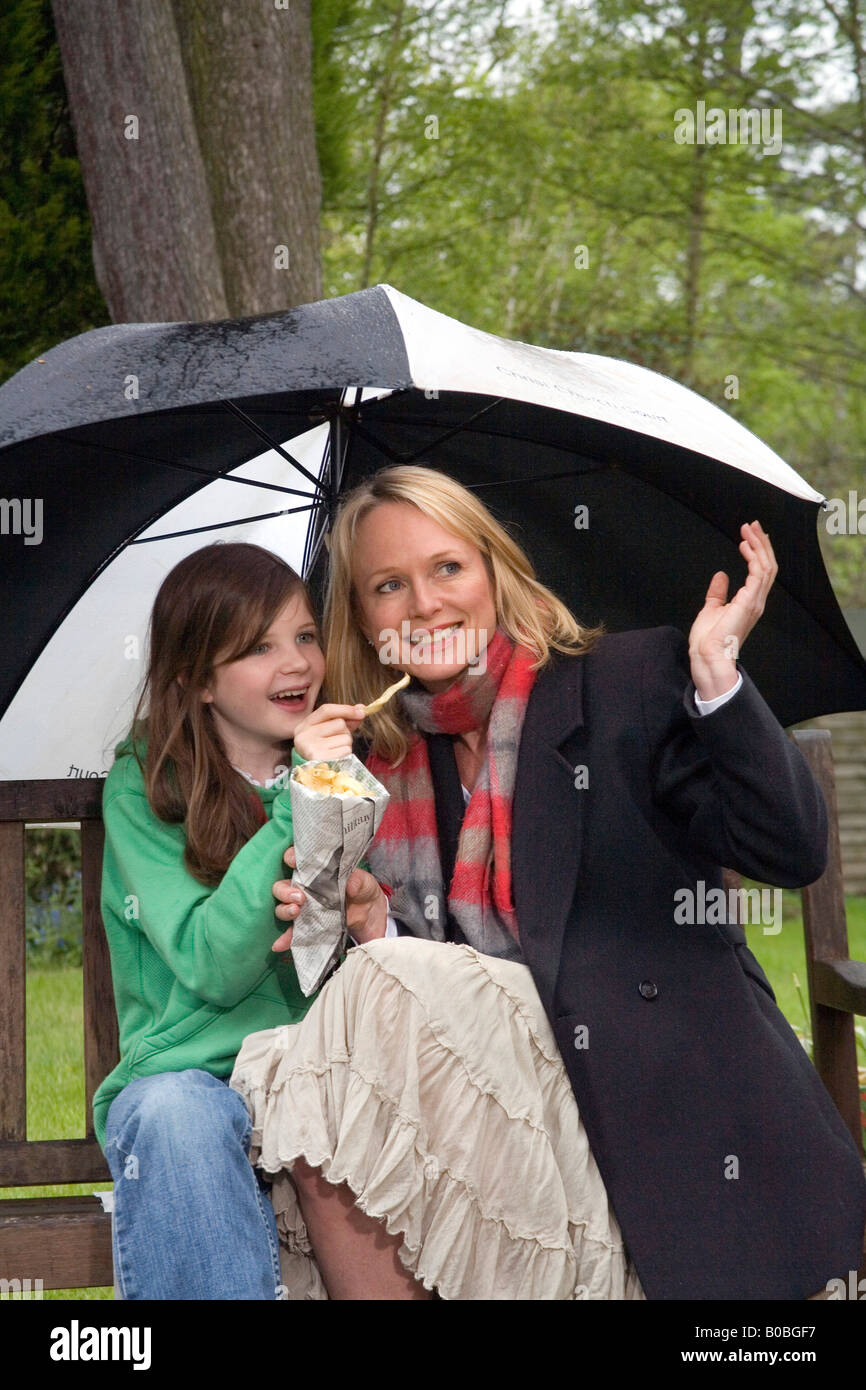 Mum and Daughter eating Chips Stock Photo - Alamy