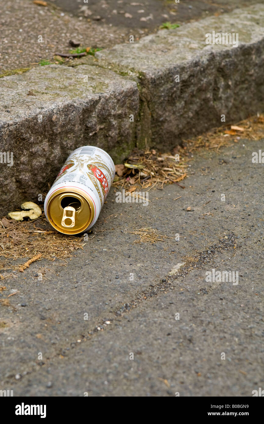 An ^empty beer can in the gutter, UK Stock Photo - Alamy