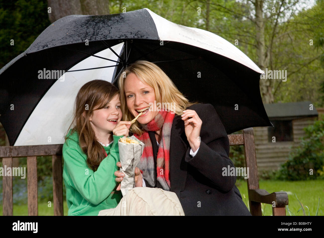 Mum and Daughter eating Fish and Chips Stock Photo - Alamy