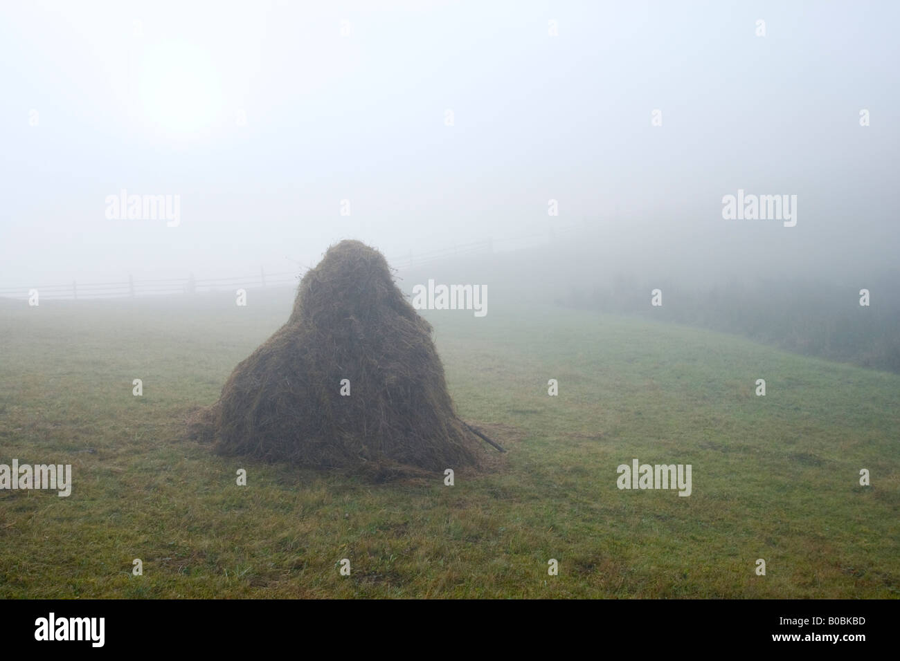 Haystack on misty morning mountainside Stock Photo - Alamy