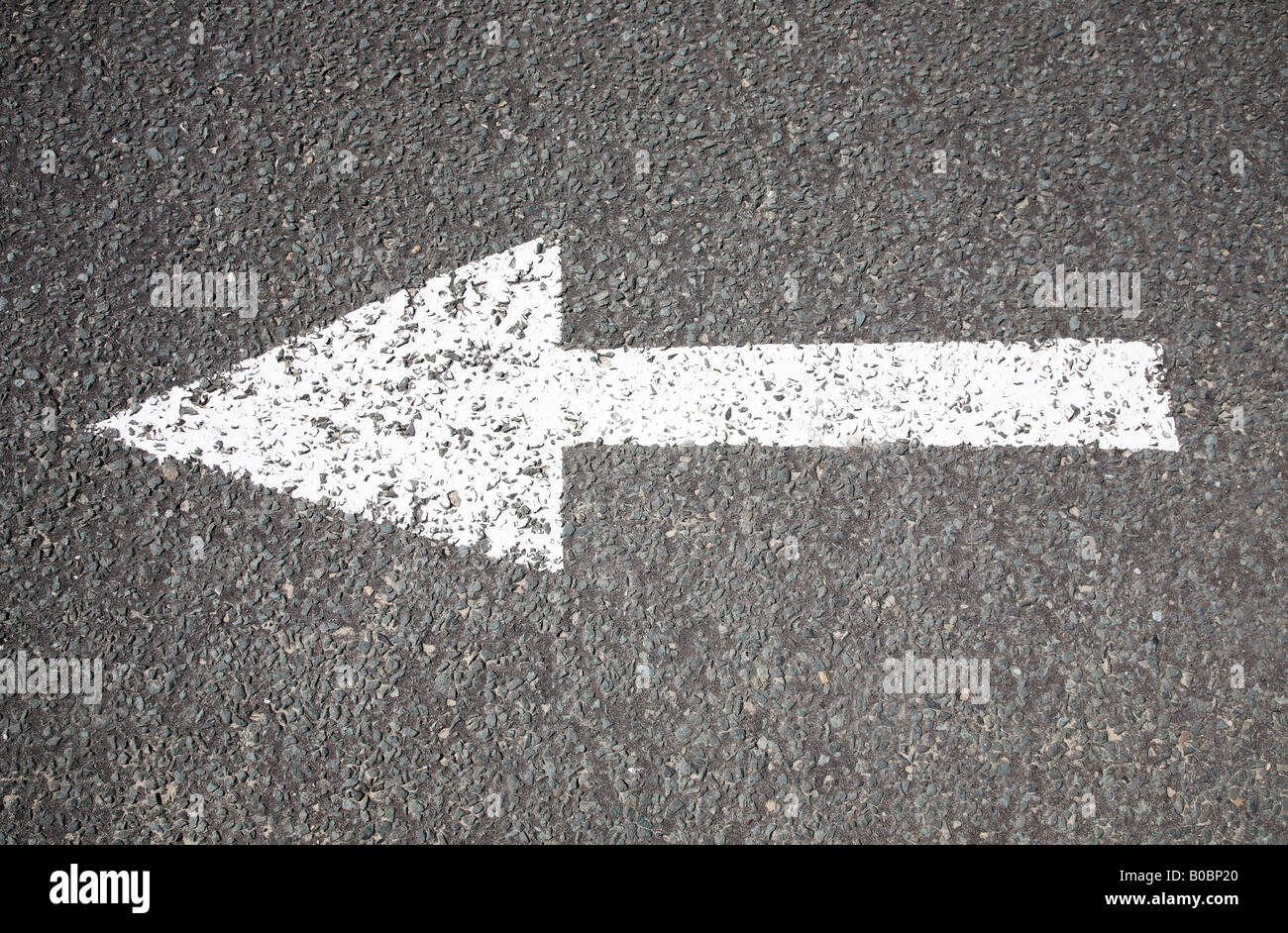 Arrow on road Stock Photo - Alamy