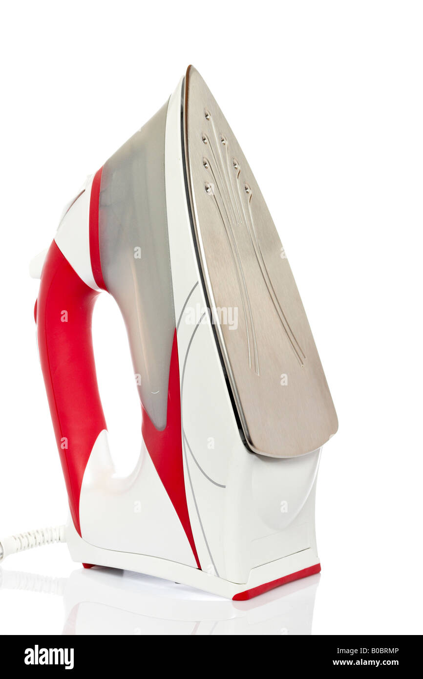 Red electric iron reflected on white background Shallow depth of field ...