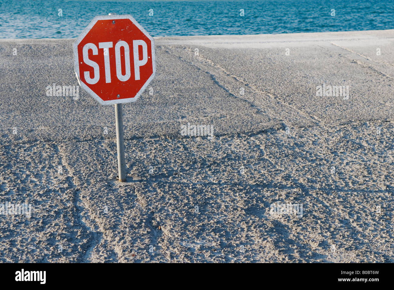 Stop sign in front of water Stock Photo - Alamy
