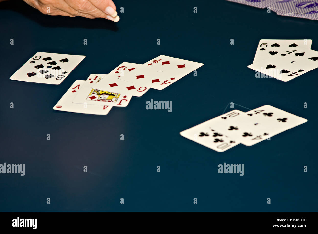 Playing cards are laying on a table Stock Photo - Alamy