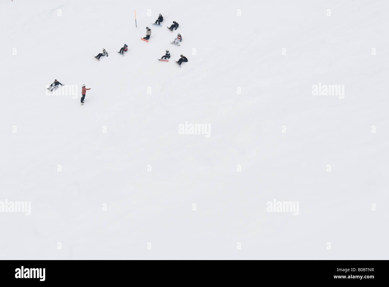 Snowboard class having a break Stock Photo - Alamy