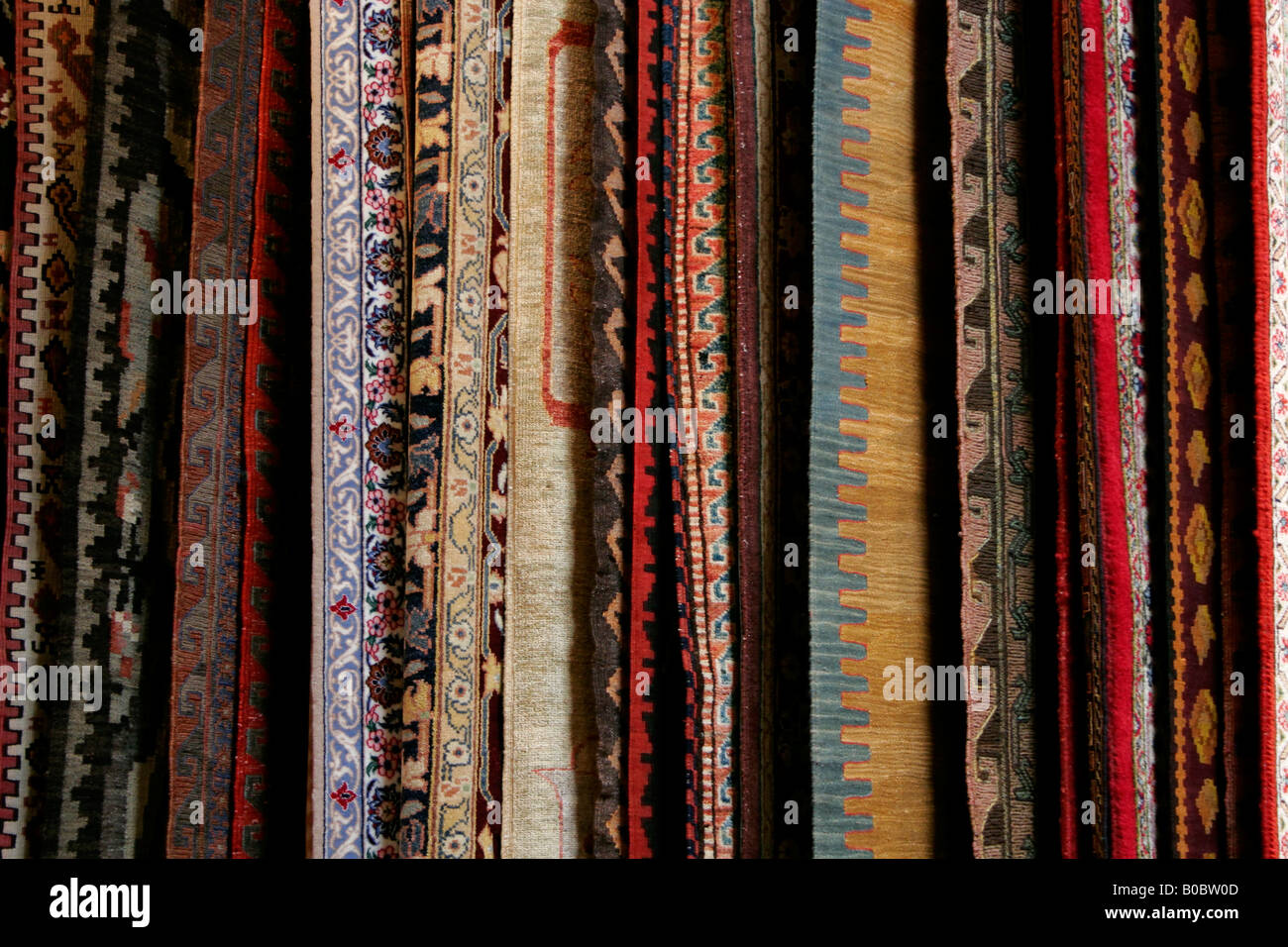 Selection of oriental rugs hanging in a shop Stock Photo - Alamy