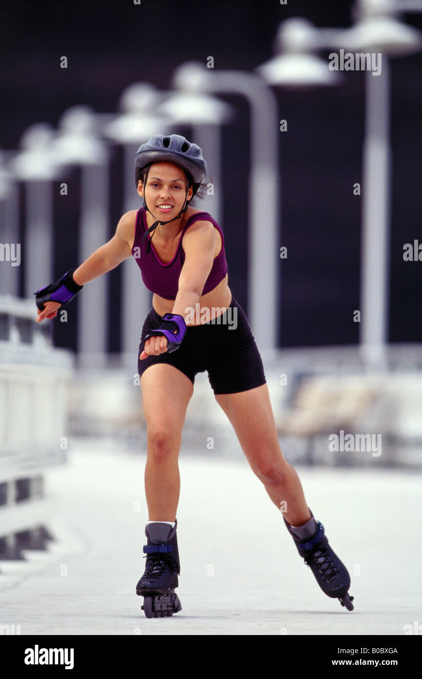 Female Inline skater exercising Stock Photo - Alamy
