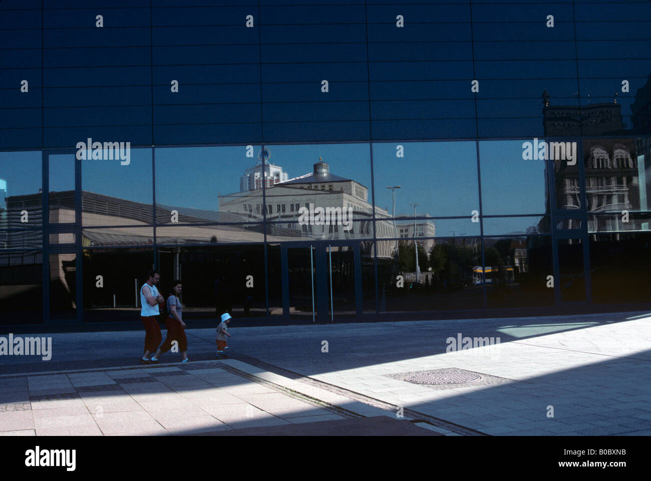 Reflection of building in large window Stock Photo - Alamy