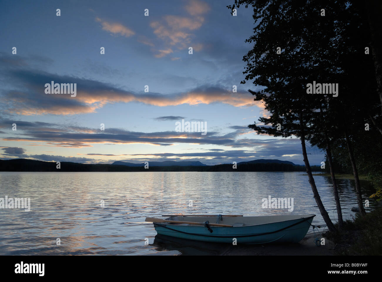 Small rowing boat on the Lake Orten in twilight Sveg Sweden August 2007 ...
