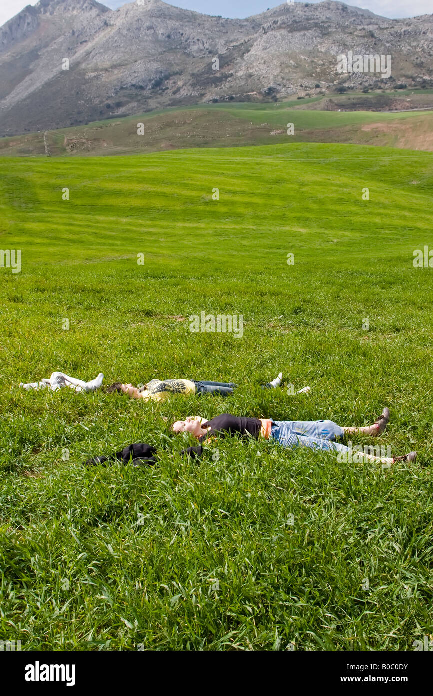 Two girls sleeping on grass hi-res stock photography and images - Alamy