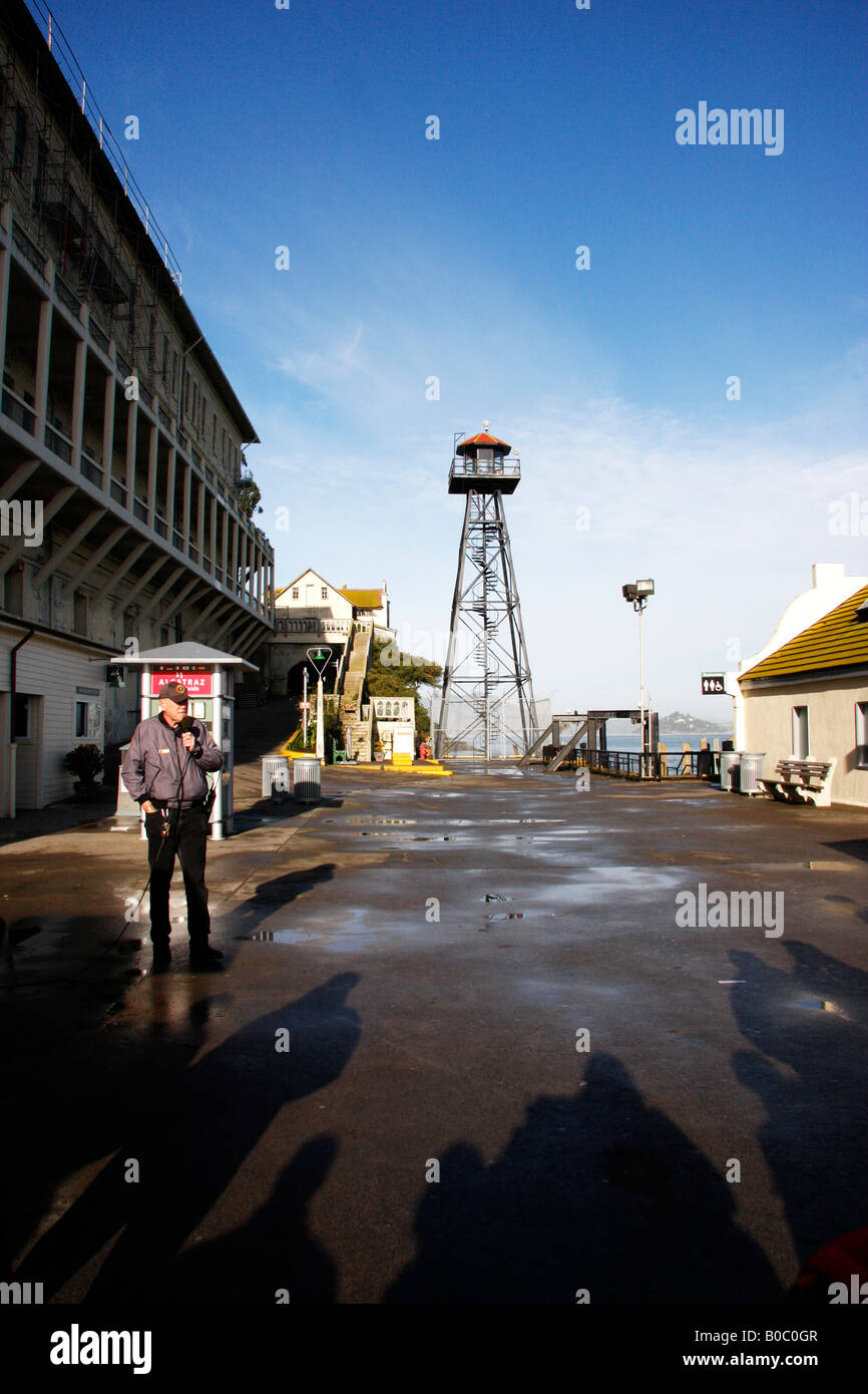 Alcatraz prison guard and guide welcomes tourists on a sightseeing day ...
