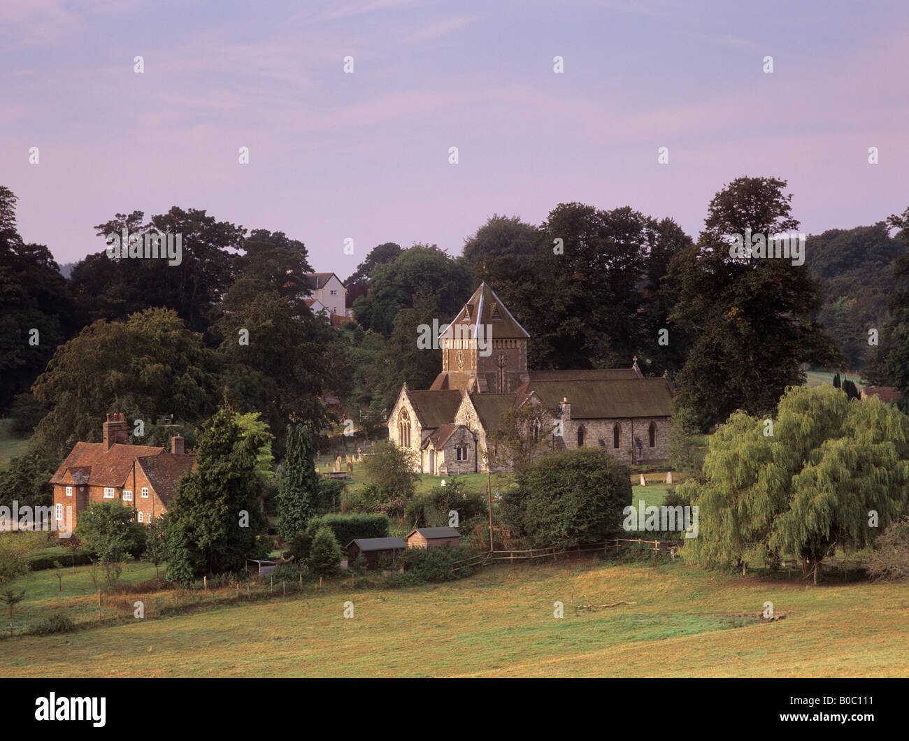 Church and Vicarage in early morning in rural English country village ...