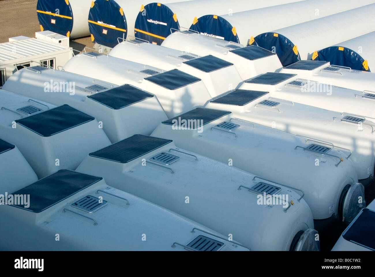 Wind farm components generators and tower sections Stock Photo - Alamy