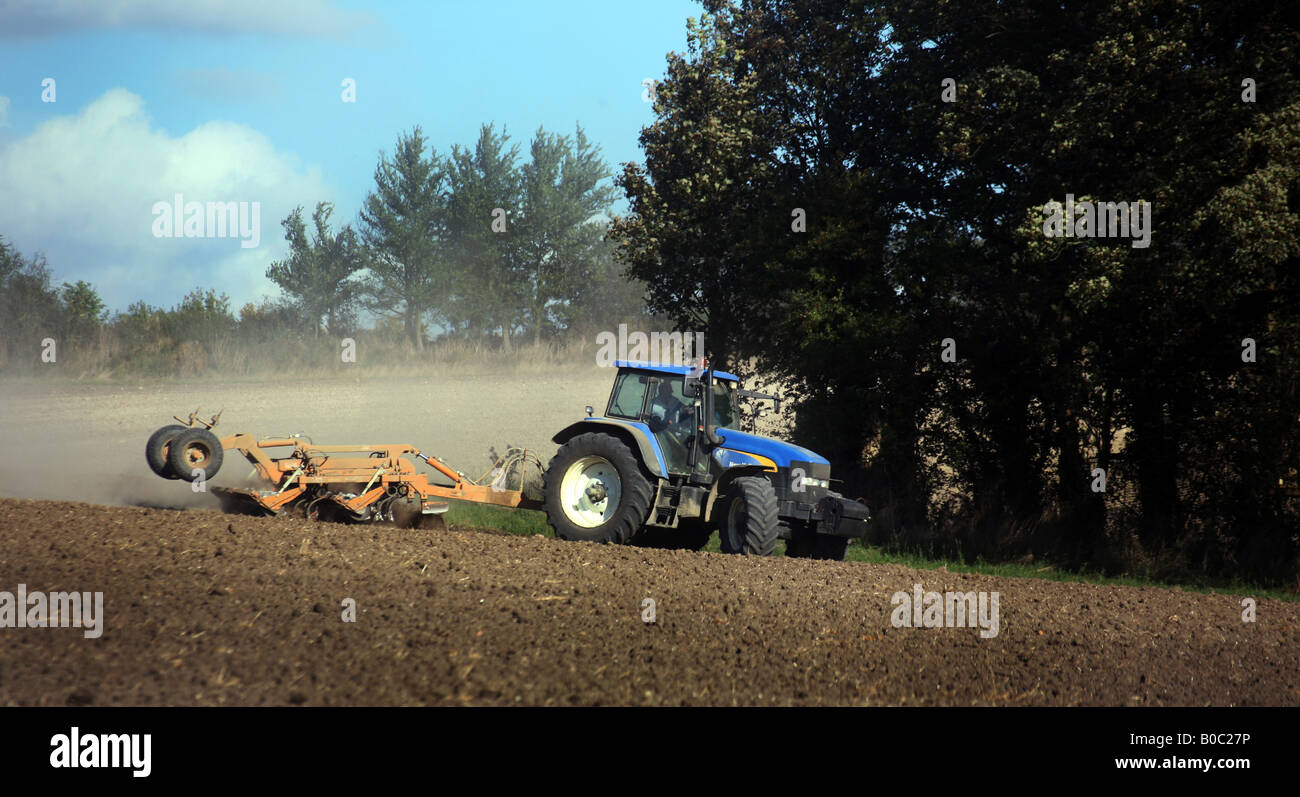 A tractor rolling fields in Clare Suffolk UK Stock Photo - Alamy