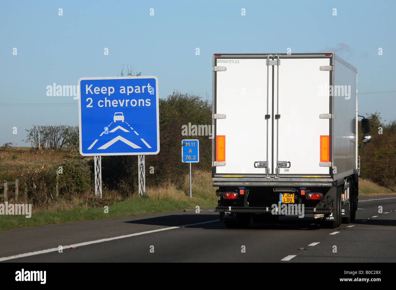 Articulated lorry passing sign stating to keep apart two chevrons Stock ...