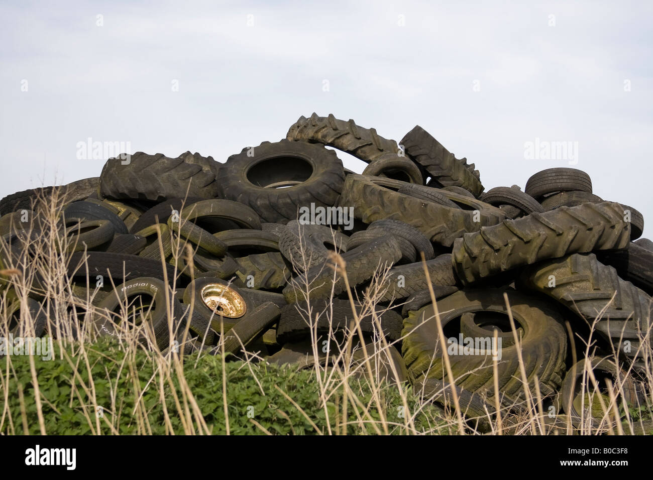 Stacks of old and used tyres ready for recycling Stock Photo - Alamy