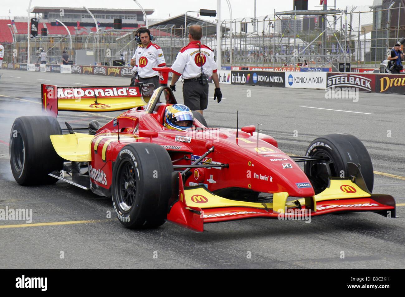 Race car driver and pit crew at the Toronto Grand Prix, Molson Indy in ...