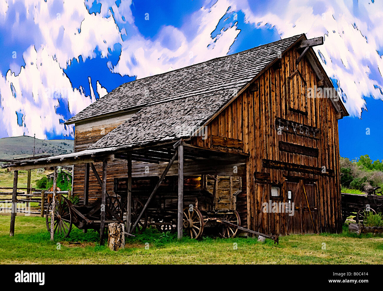Image of an old Livery Stable with several old wagons next to it and a ...