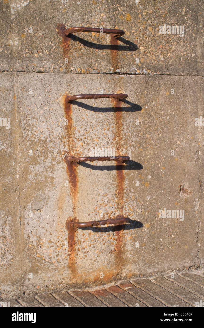 Rusting harbour wall ladder Stock Photo - Alamy