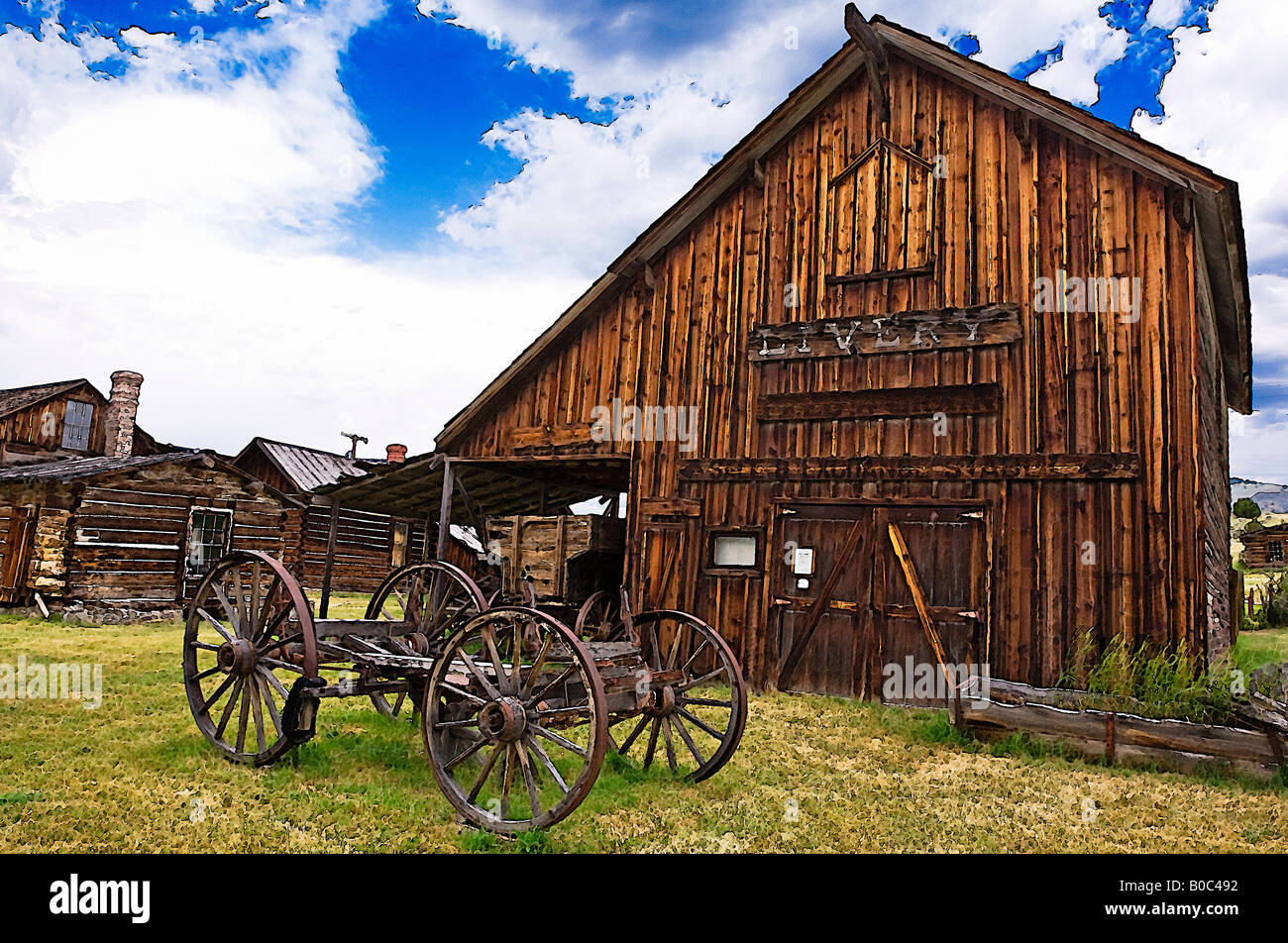 Image of an old Livery Stable with several old wagons next to it and a ...