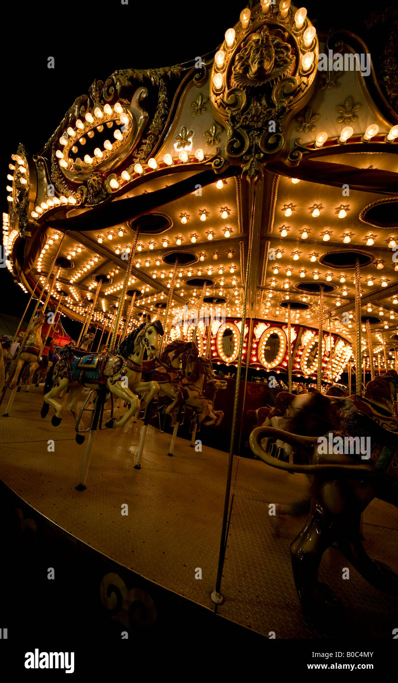 Carousel with children riding at night Stock Photo - Alamy