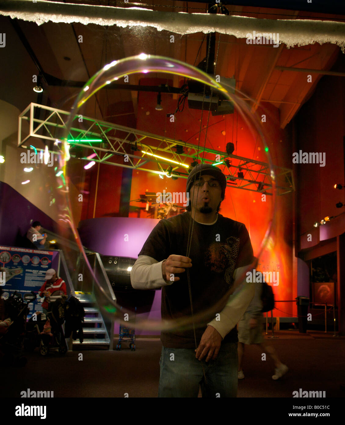 Man blowing a large soap bubble at the Pacific Science Center, Seattle ...