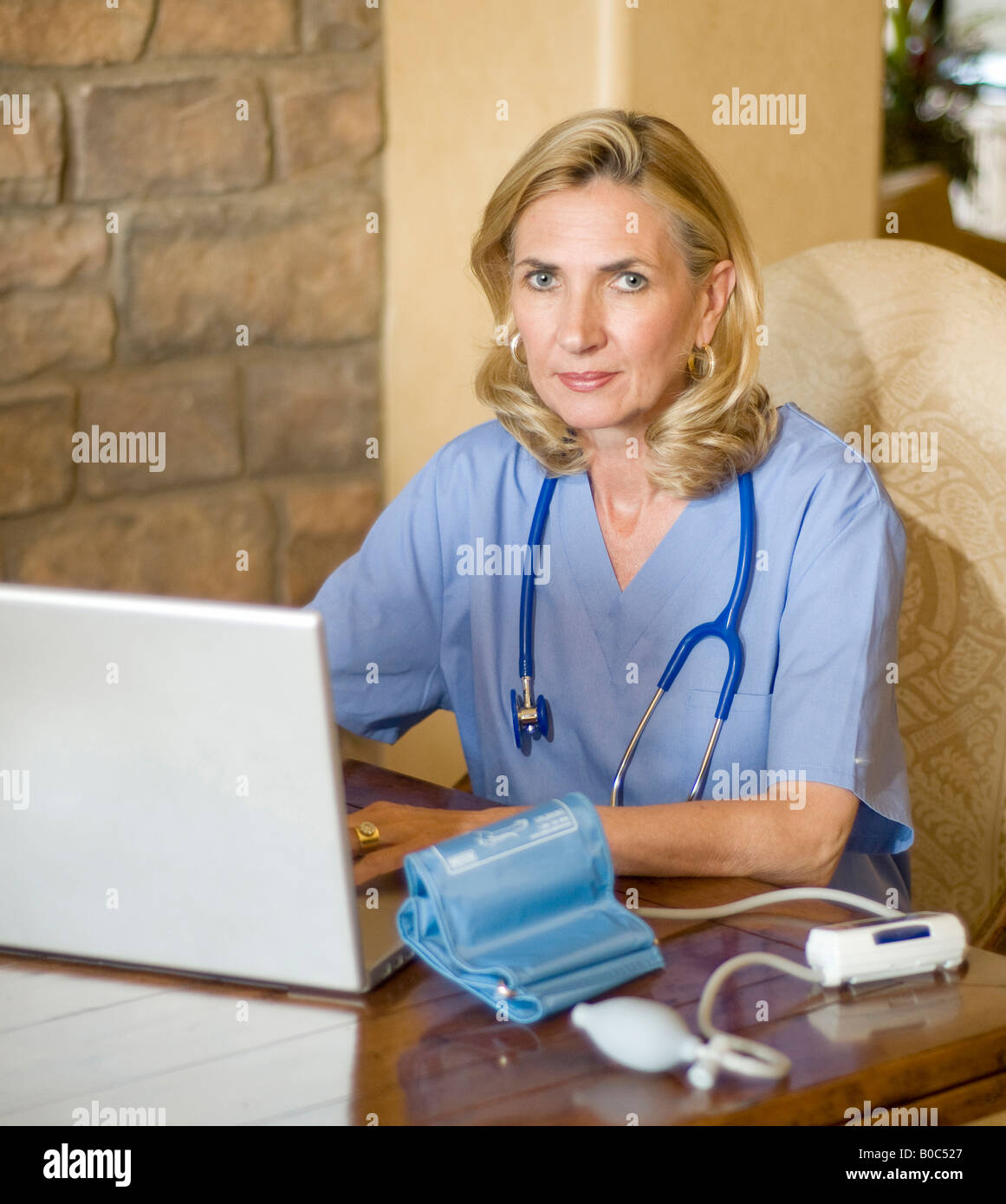 Blood pressure check at the Doctors office Stock Photo - Alamy