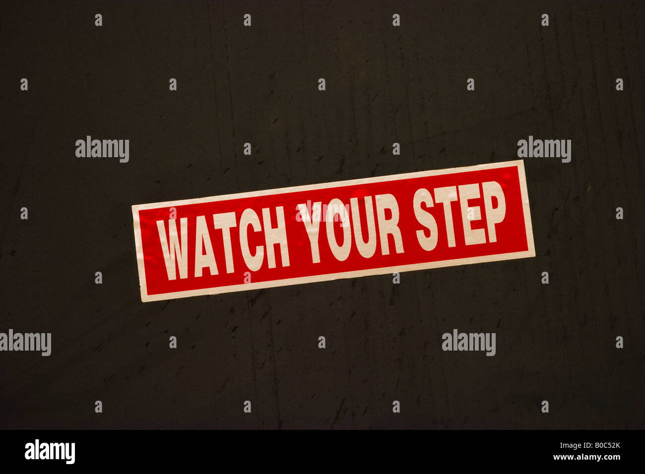 WATCH YOUR STEP sign Stock Photo - Alamy
