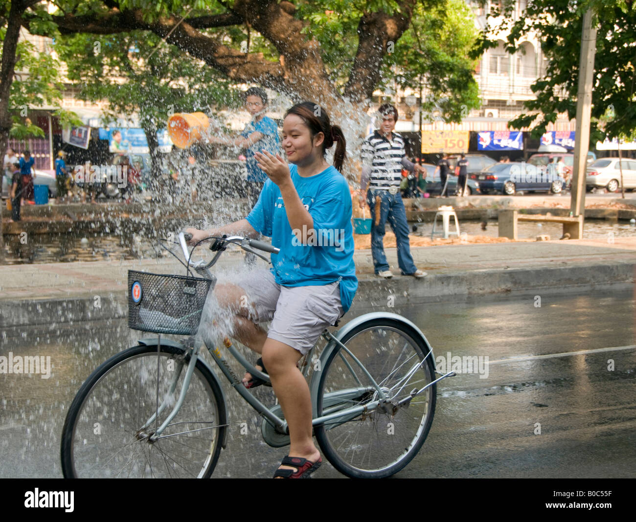 woman getting wet at water festival Stock Photo - Alamy
