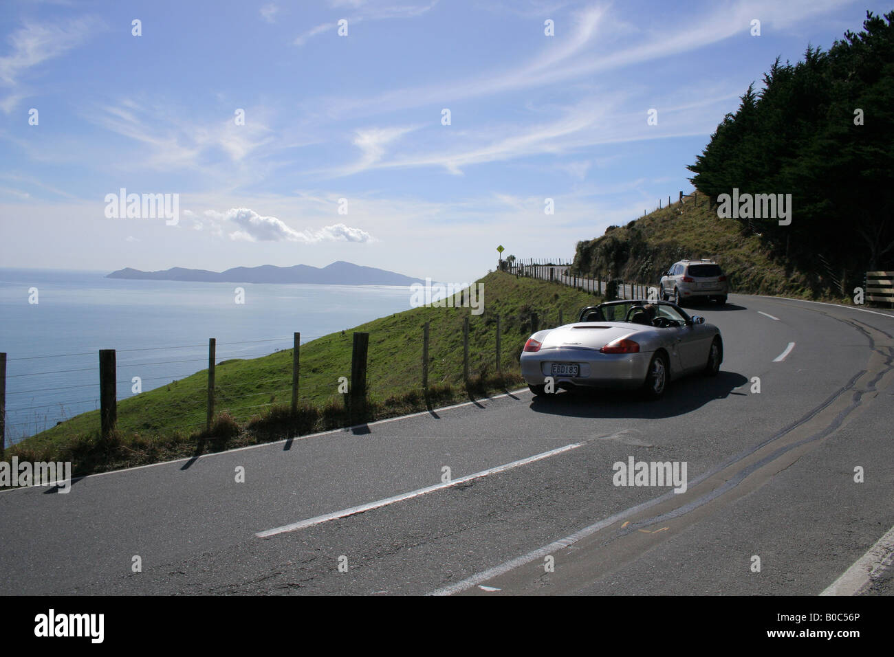 Cars drive along mountain road hi-res stock photography and images - Alamy