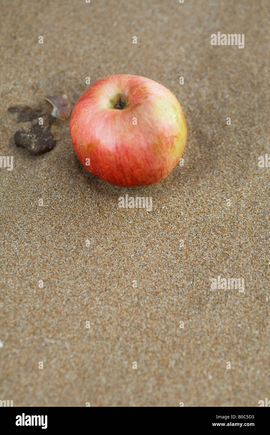 A lost apple on the beach Stock Photo - Alamy