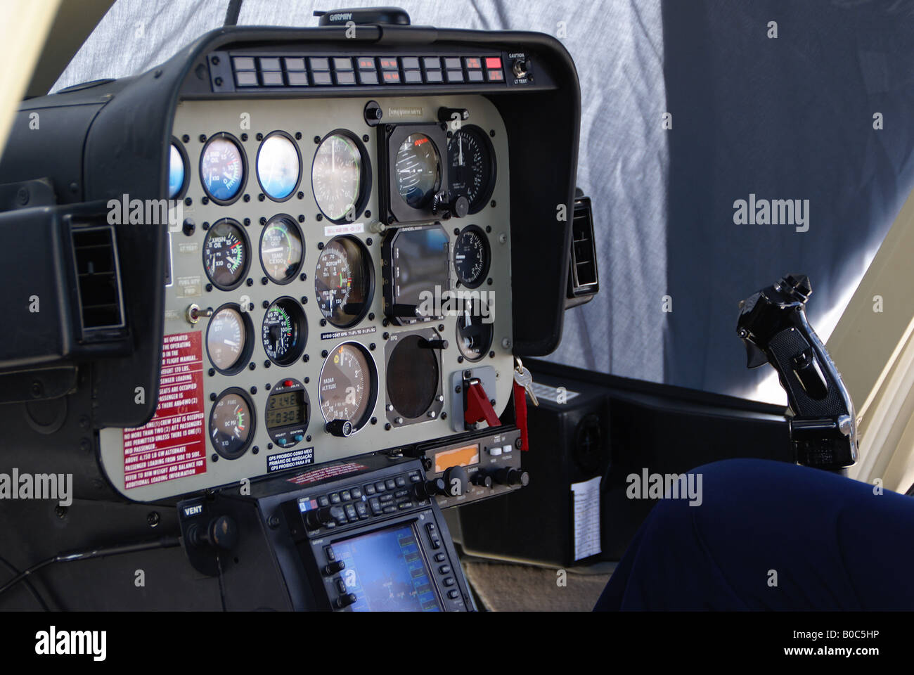 The cockpit controls of a Bell Ranger six seater helicopter Stock Photo ...