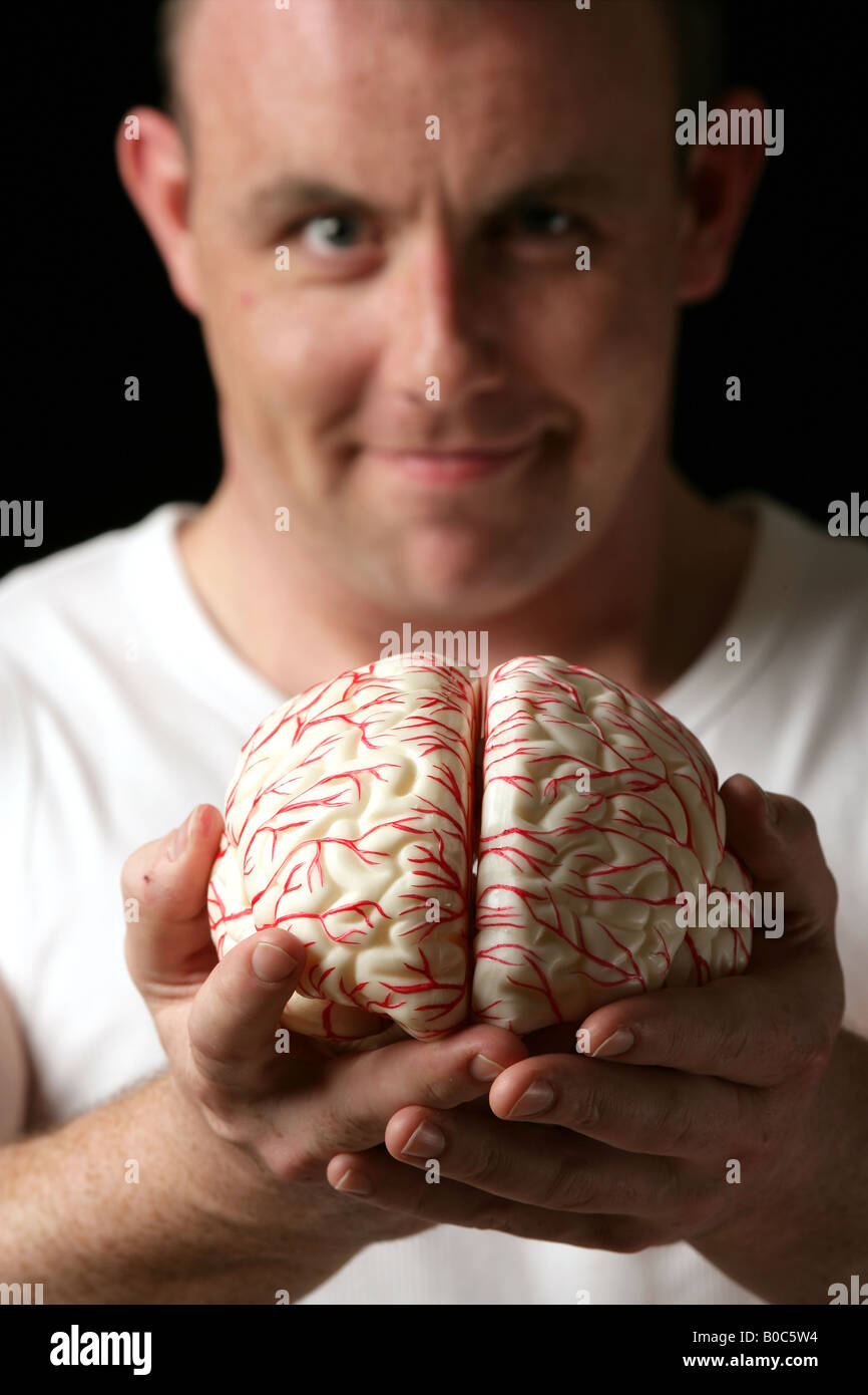 "Simon Lannon holding a model brain Simon has had 29 brain opperations ...