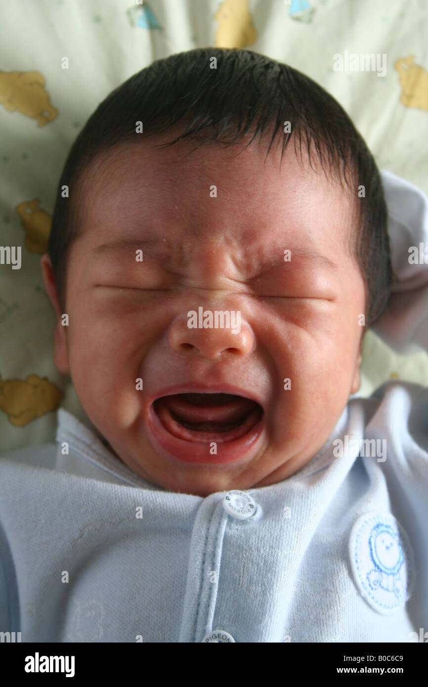 Chinese baby boy crying with mouth open Stock Photo - Alamy