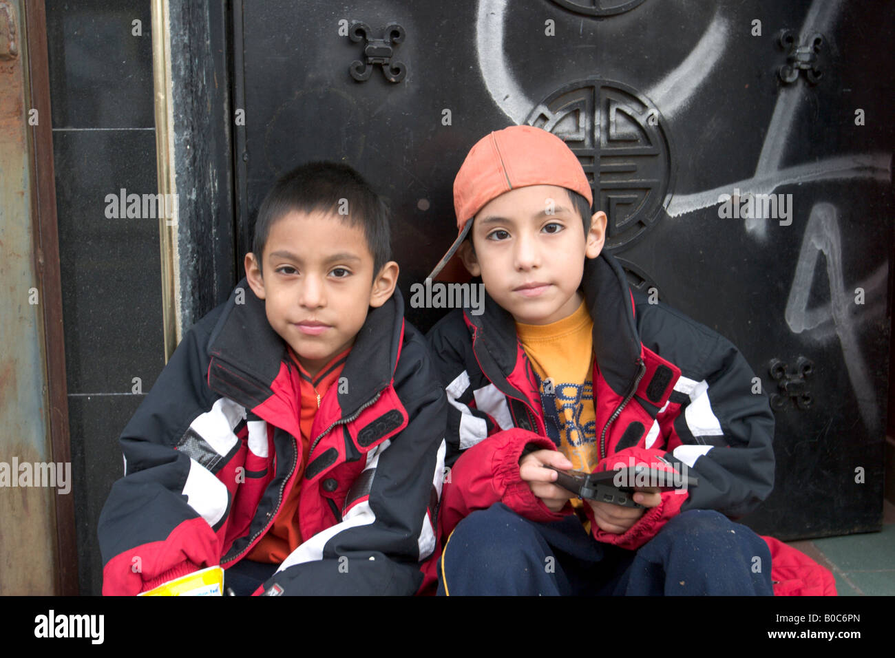 Portrait of two boys on a building stoop in Brooklyn, New York Stock ...