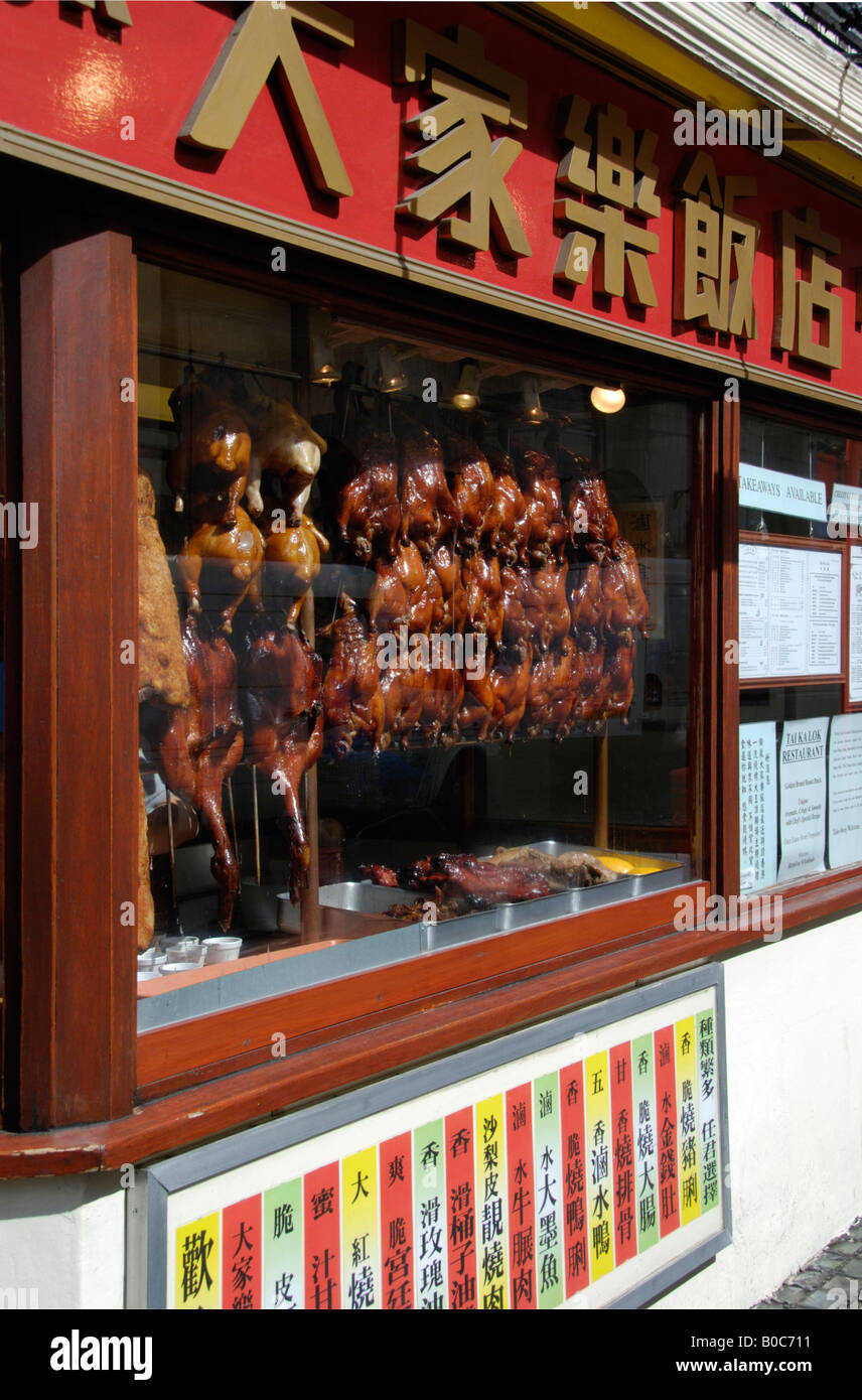 Roasted chickens and ducks hanging in Chinese restaurant window ...