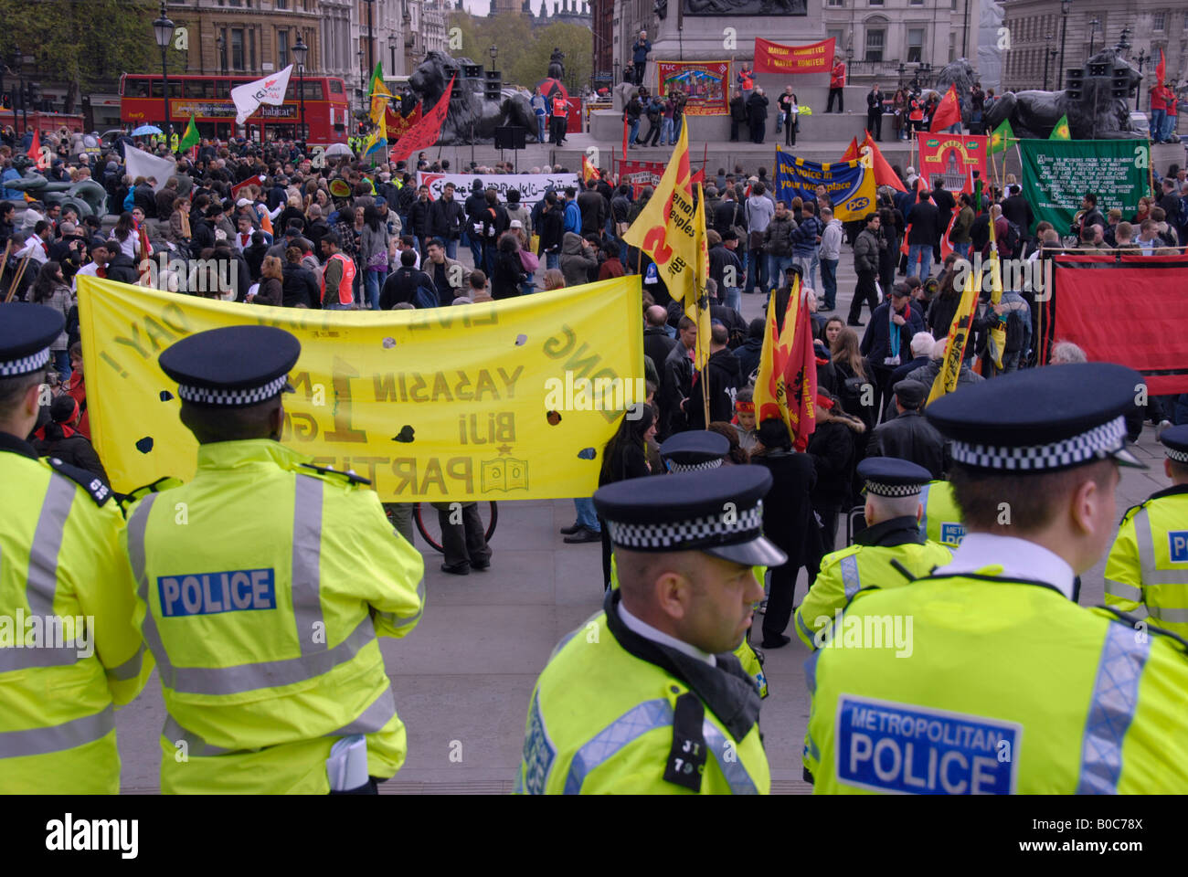 Police watching over the 2008 May Day parade in Trafalgar Square London ...