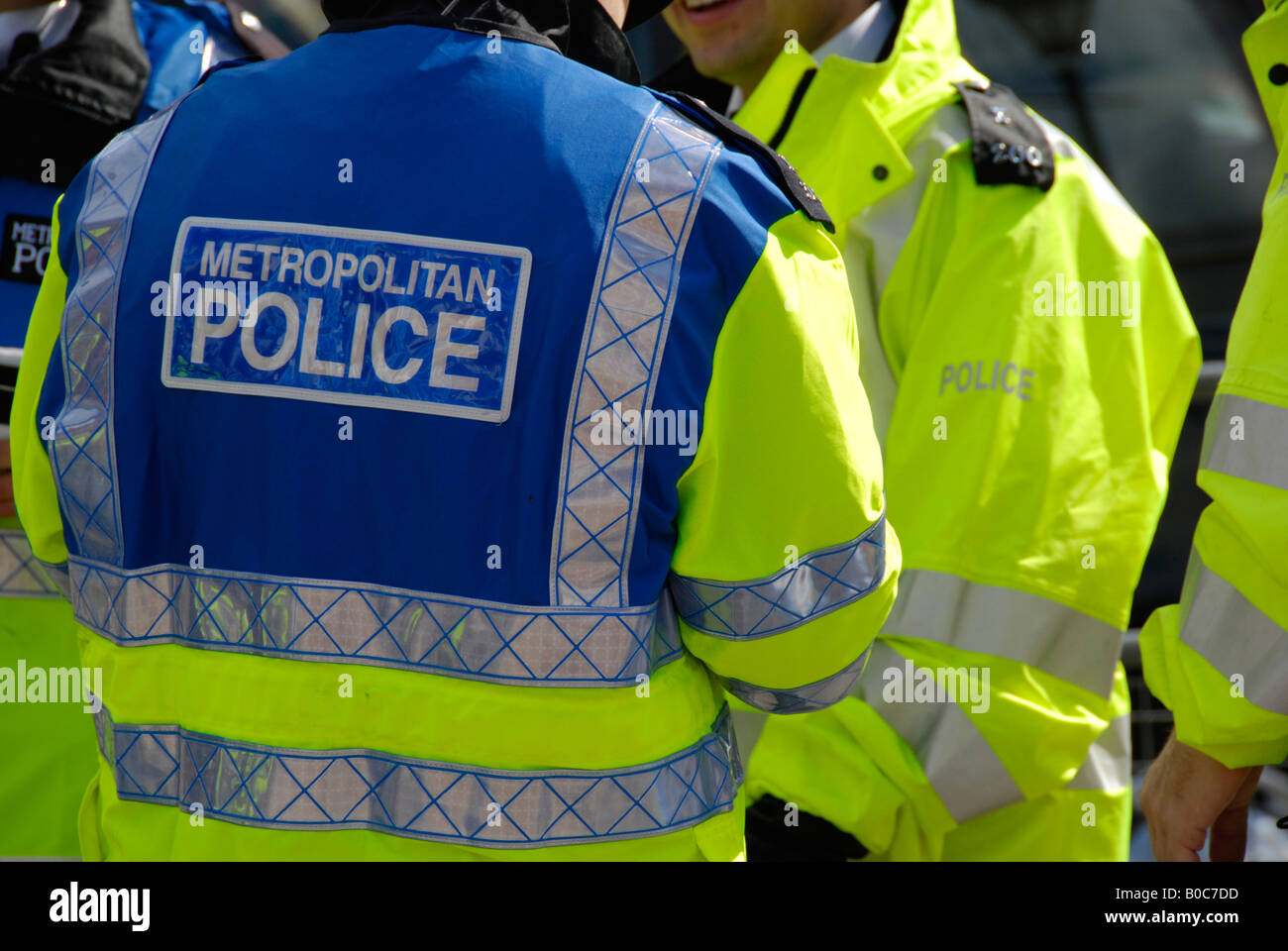 Close up of London Metropolitan Police in bright yellow and blue ...