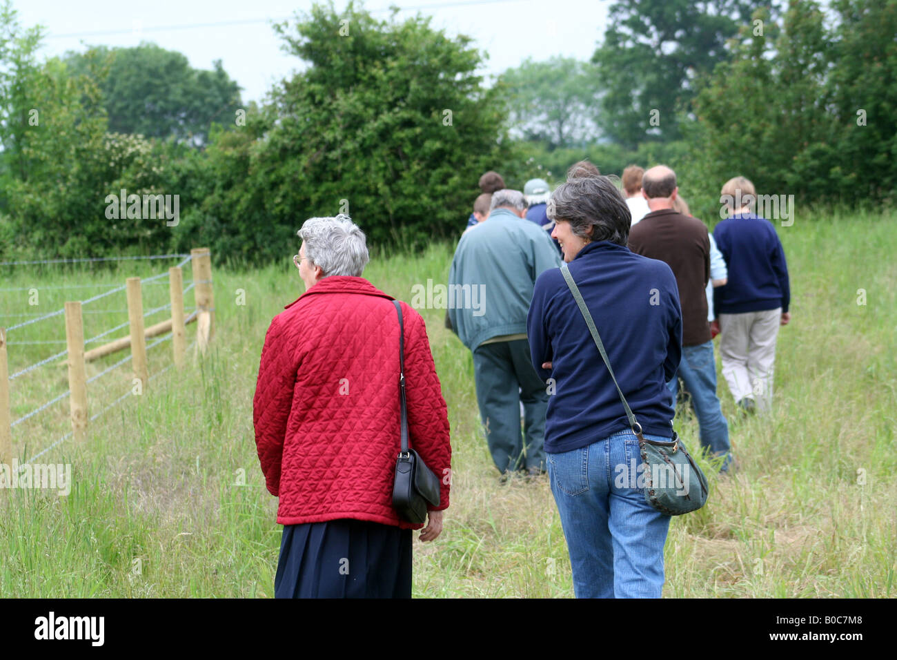 Group on a farm tour Stock Photo - Alamy