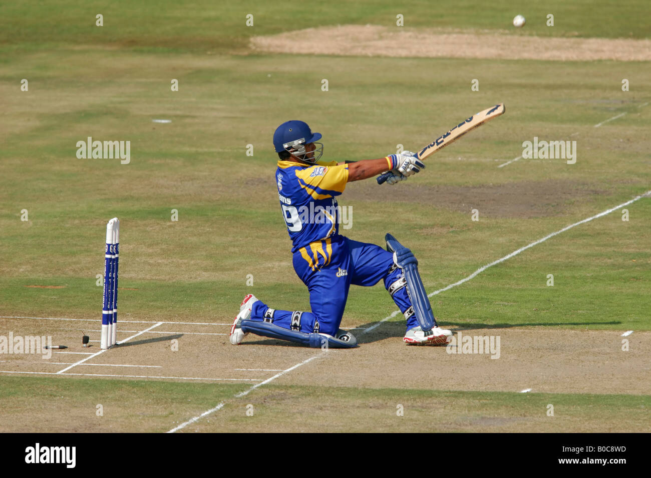 Cricket batsman hitting cricket ball hi-res stock photography and ...