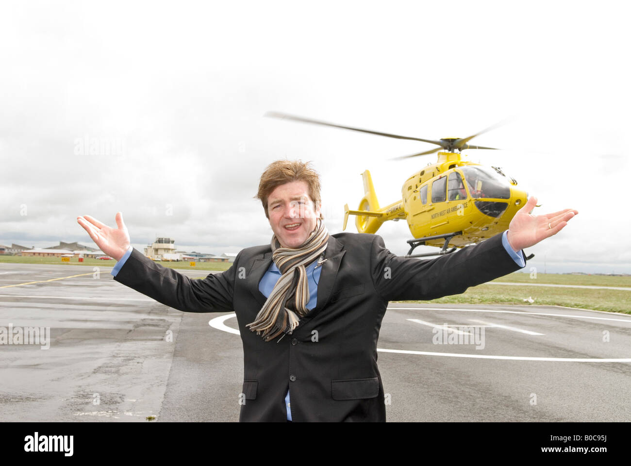 Opera singer Martin Toal sings over the sound of a helicopter landing ...