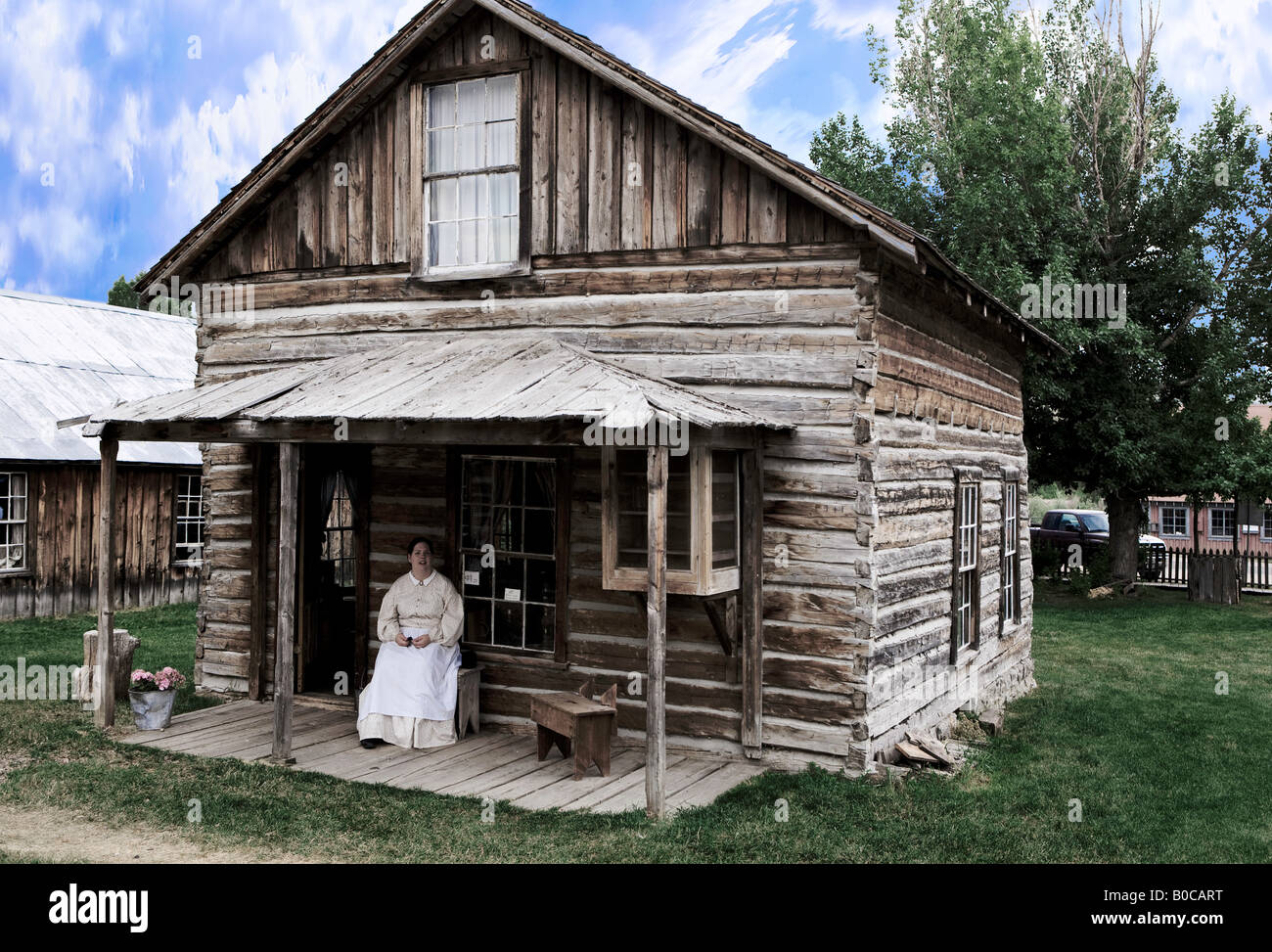 Image of a middle aged woman dressed in pioneer style clothing sitting ...