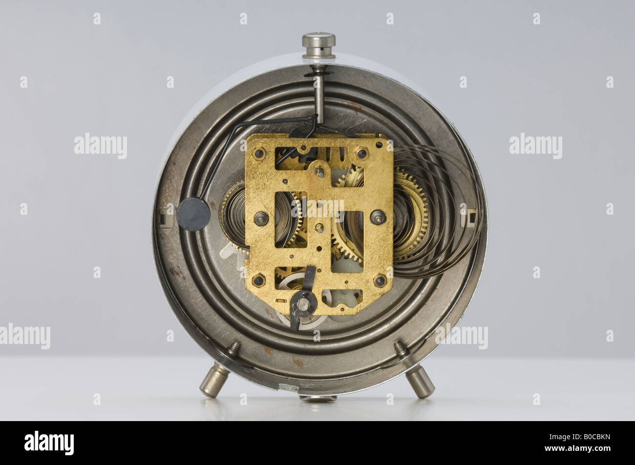Inside of clockwork alarm clock Stock Photo - Alamy